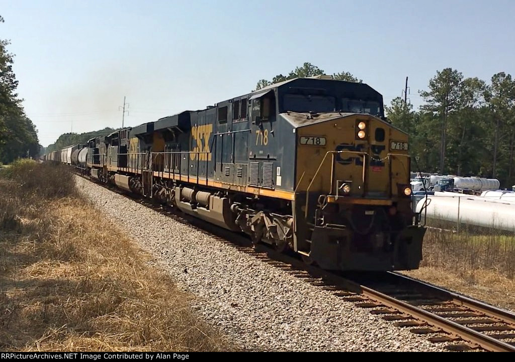 With CSX 888 in tow between, CSX 718 and 168 power mixed freight NB
